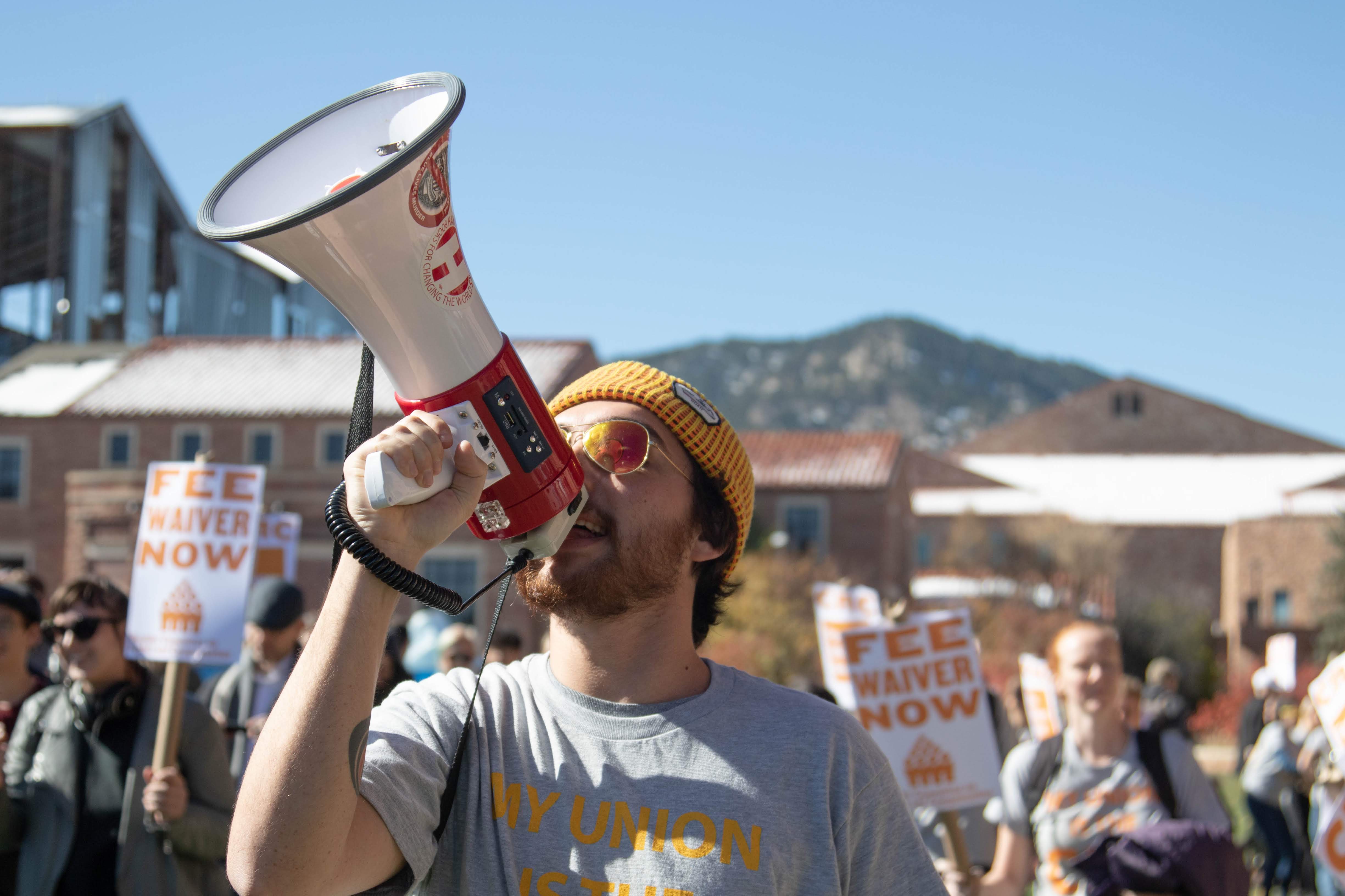 Graduate students end week-long protests over fees with rally